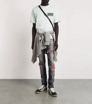 Amiri Ripped Skinny Jeans With Flannel Inlays