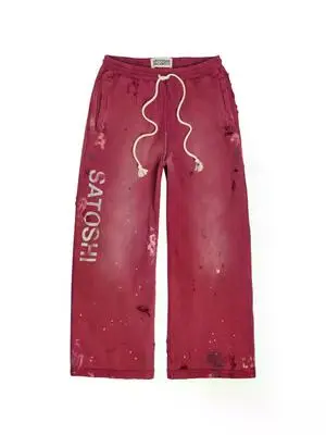 SATOSHI NAKAMOTO Distressed Paint-splatter Track Pants - Red