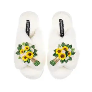 LAINES LONDON Embellished Faux Fur Cross Strap Slippers With Floral Brooch - White