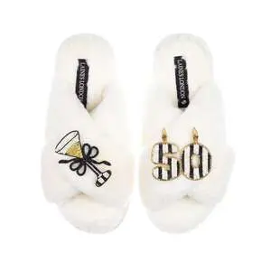 LAINES LONDON Classic Faux Fur Slippers With Champagne Glass And '50' Brooch Detail - White