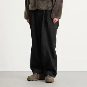 AND WANDER Crinkled Nylon Trousers