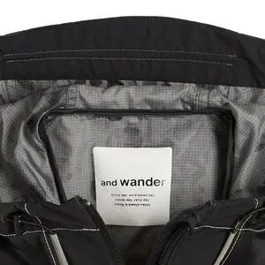 AND WANDER End. X Nylon Print Jacket