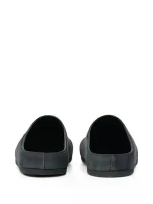 Studio Nicholson Wearing Leather Clogs