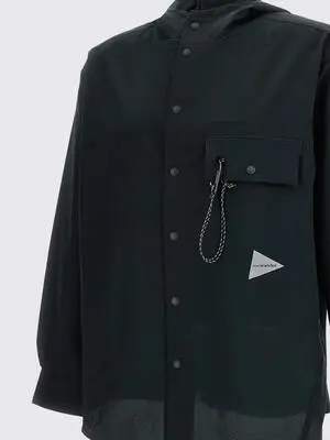 AND WANDER Polyester Windbreaker Jacket With Hood And Patch Pockets