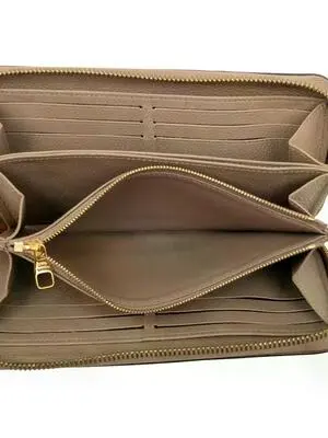 LOUIS VUITTON 2010-2026 Bicolor Monogram Empreinte Giant Zippy Wallet Long Wallets - Brown