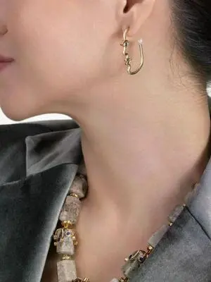 EDINA KISS Face Hoop Earrings