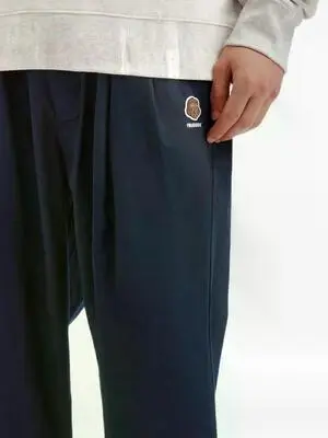 FINGERCROXX Pleated Logo-patch Trousers
