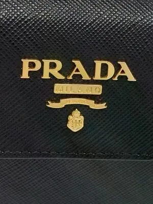 Prada Saffiano-leather Mini Clutch Bag