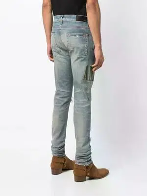 Amiri Logo-embroidered Ripped-detail Jeans