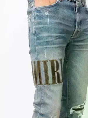 Amiri Logo-embroidered Ripped-detail Jeans