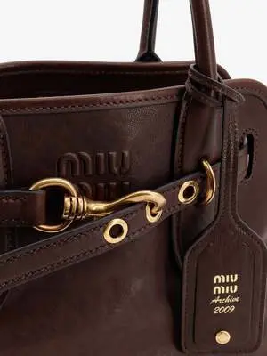 Miu Miu Aventure Leather Handbag With Embossed Lettering Logo