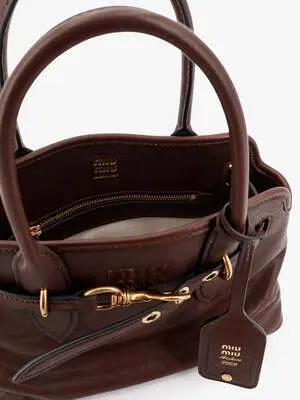 Miu Miu Aventure Leather Handbag With Embossed Lettering Logo