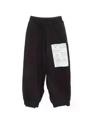 MAISON MARGIELA 2010s Newspaper-print Track Pants - Black