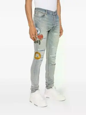 Amiri Travel Patch Repair Skinny Jeans