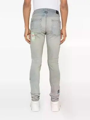 Amiri Travel Patch Repair Skinny Jeans