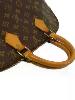 LOUIS VUITTON Alma Monogram Handbag