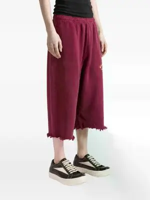 WILLY CHAVARRIA Logo-print Frayed-edge Track Shorts