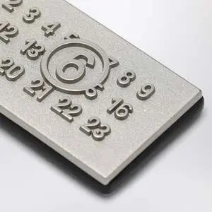 MAISON MARGIELA Numeric Charm In Brass And Leather
