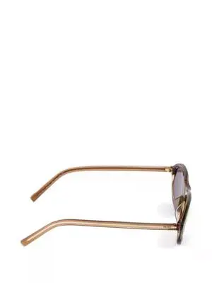 Prada Sunglasses With The Iconic Metal Plaque