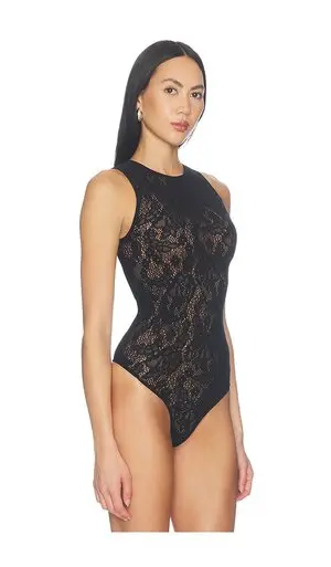 Wolford Infinite Rose Net Bodysuit In . Also