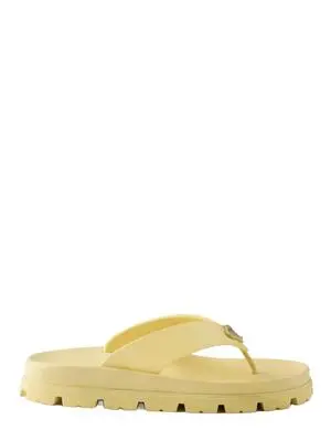 Prada Enameled Triangle Rubber Thong Sandals - Yellow