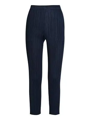 Issey Miyake Tapered-leg Pleated Trousers - Navy