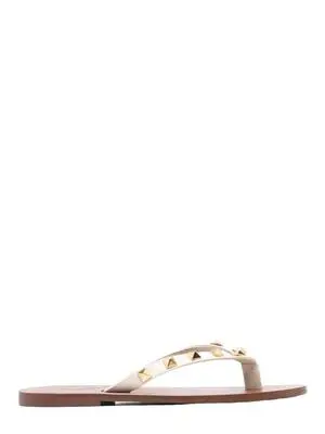 Valentino Garavani Valentino Garavani Rockstud Embellished Flat Rubber Sandals Neutrals