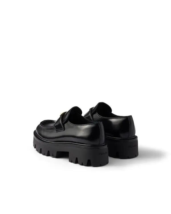 Prada Brushed Leather Loafers With Enameled Triangle Logo - Black