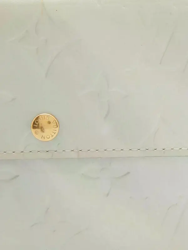 LOUIS VUITTON Monogram-debossed Leather Wallet