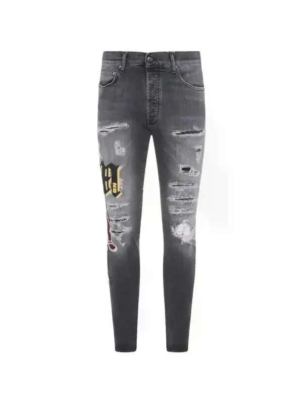 Amiri Ripped Patch Skinny Jeans