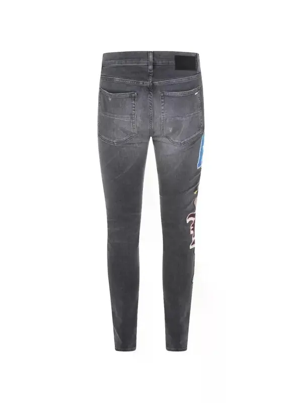 Amiri Ripped Patch Skinny Jeans