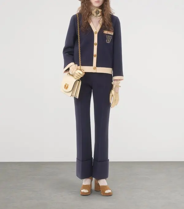 Valentino Garavani Wool-silk Flared Trousers With Turned-up Cuffs