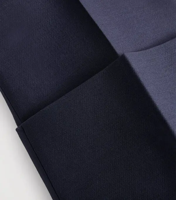 Valentino Garavani Wool-silk Flared Trousers With Turned-up Cuffs