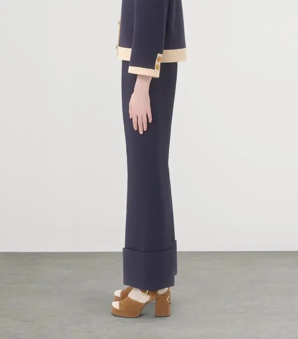 Valentino Garavani Wool-silk Flared Trousers With Turned-up Cuffs