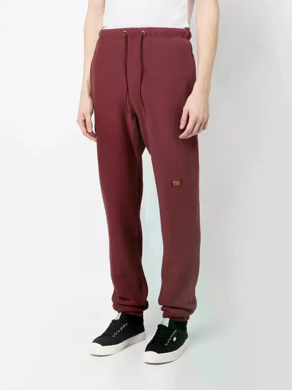 ADVISORY BOARD CRYSTALS Logo-patch Track Pants - Red