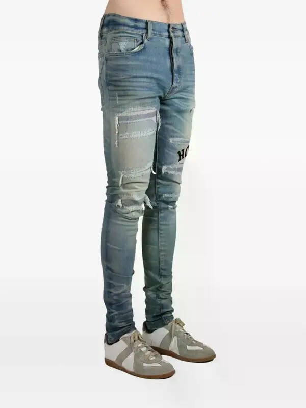 Amiri Distressed Embroidered Jeans