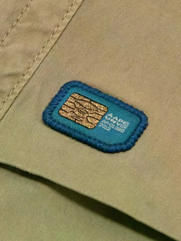 AAPE BY *A BATHING APE Logo-appliqué Trousers - Neutrals