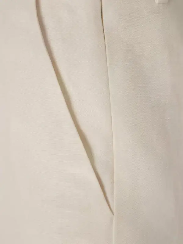 Khaite Pressed-crease Slit-hem Trousers
