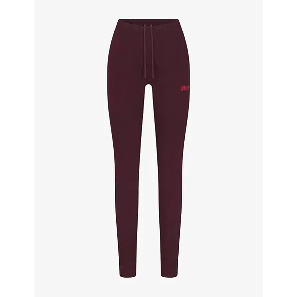SKIMS Cotton Fleece Embossed-logo Leggings - Currant