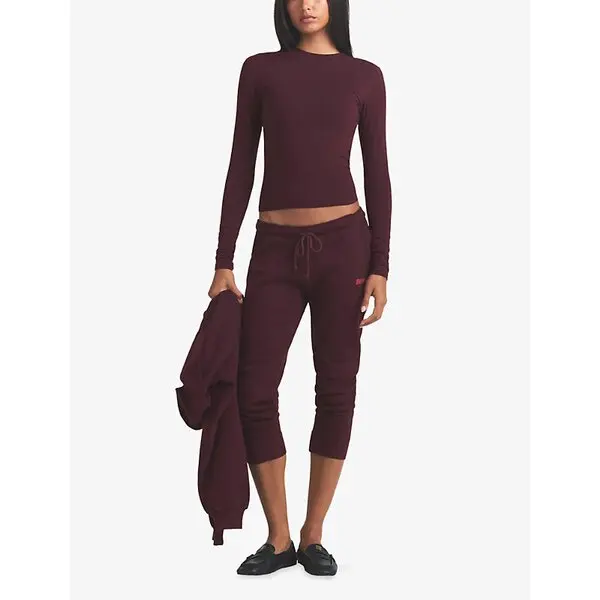 SKIMS Cotton Fleece Embossed-logo Leggings - Currant