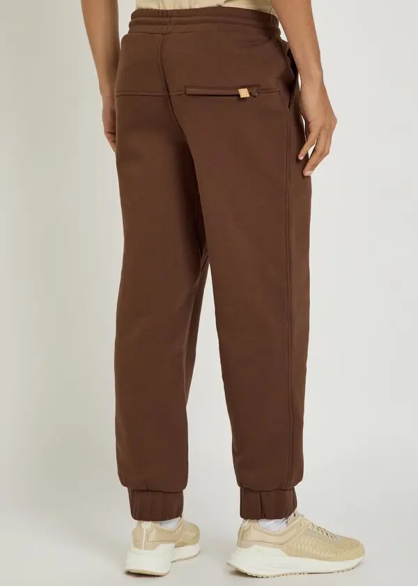 NOW YOU LIVE Magna Logo-embroidered Cotton-blend Sweatpants