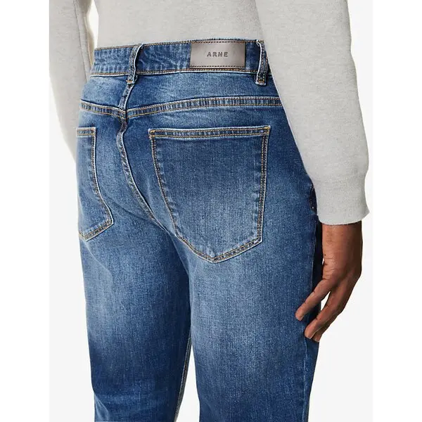 ARNE Five-pocket Tapered-leg Stretch-denim Jeans