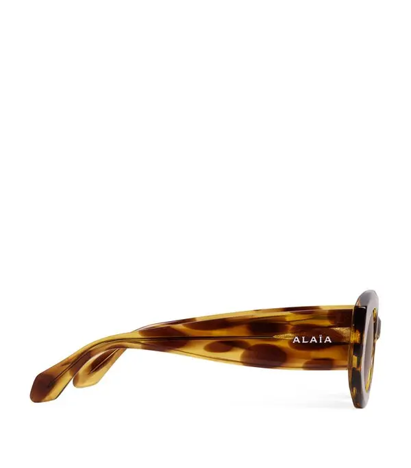 Alaïa Acetate Speckled Oval Sunglasses
