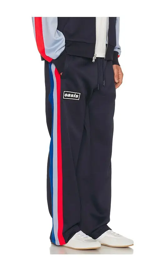 PLEASURES X Oasis Forever Track Pants In . Also - Navy