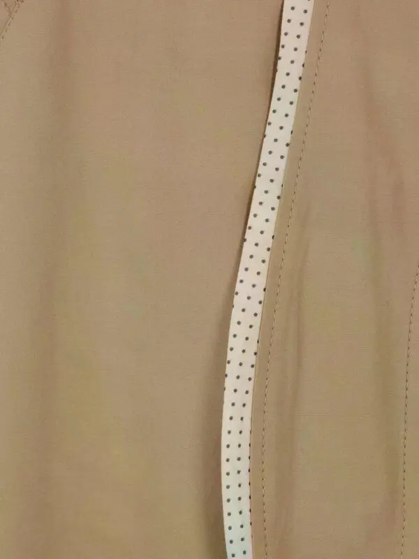 Undercover Asymmetric Hem Trench Coat