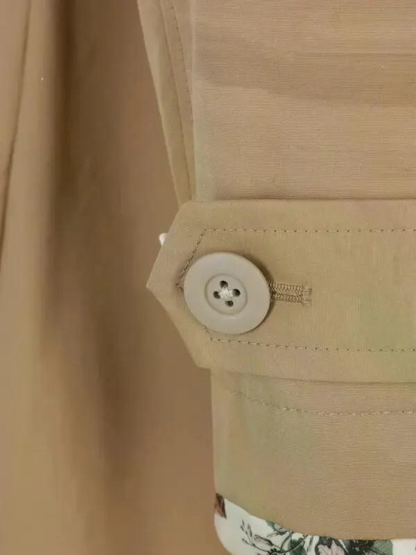 Undercover Asymmetric Hem Trench Coat