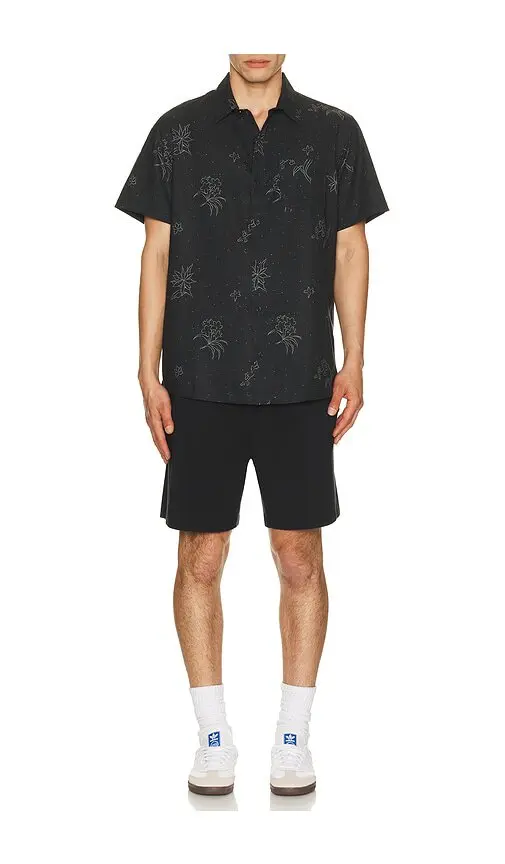 Travis Mathew Techwoven Holding Court Shirt