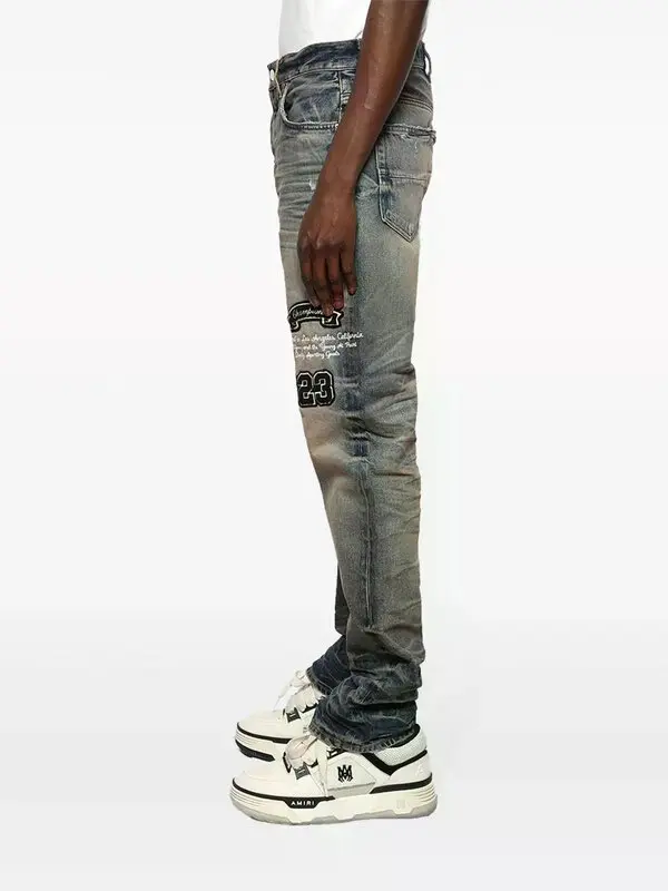 Amiri Distressed Logo Patch Jeans
