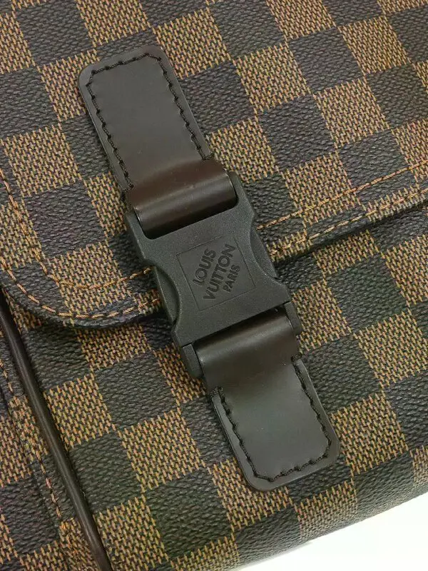LOUIS VUITTON Monogrammed Reporter Melville Cross Body Bag