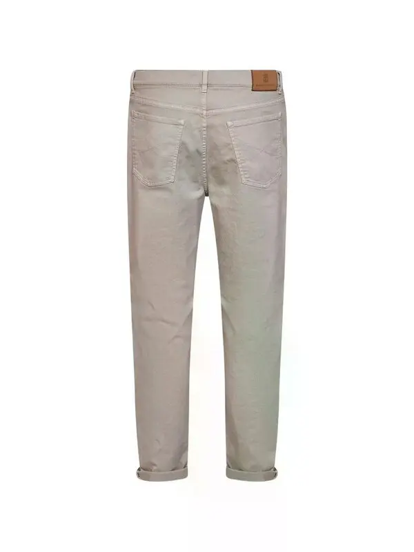 Brunello Cucinelli Garment-dyed Jeans With Embroidered Solomeo Crest - Neutrals